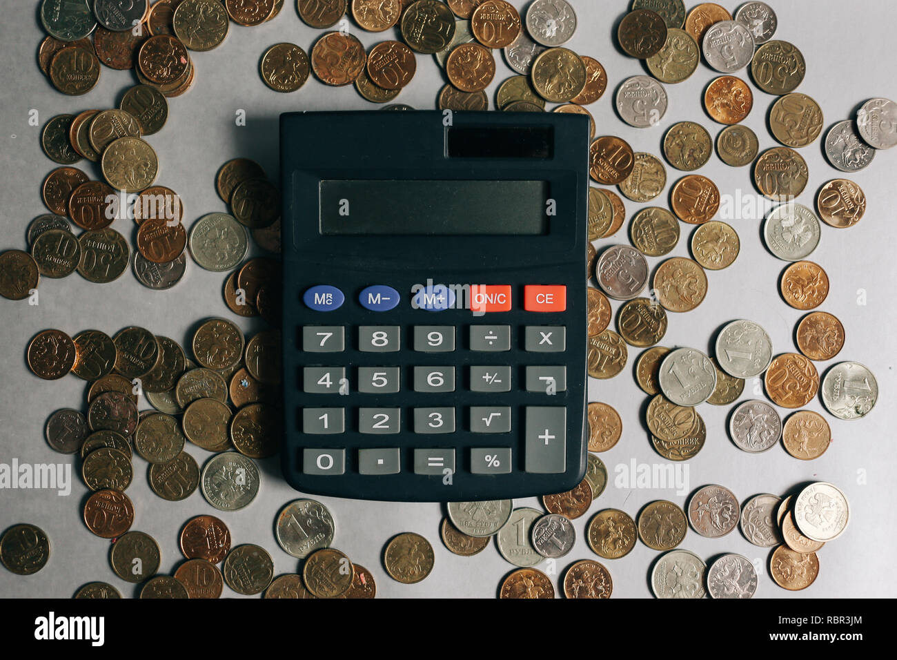 Russian money, coins and banknotes, calculator on the grey background ...