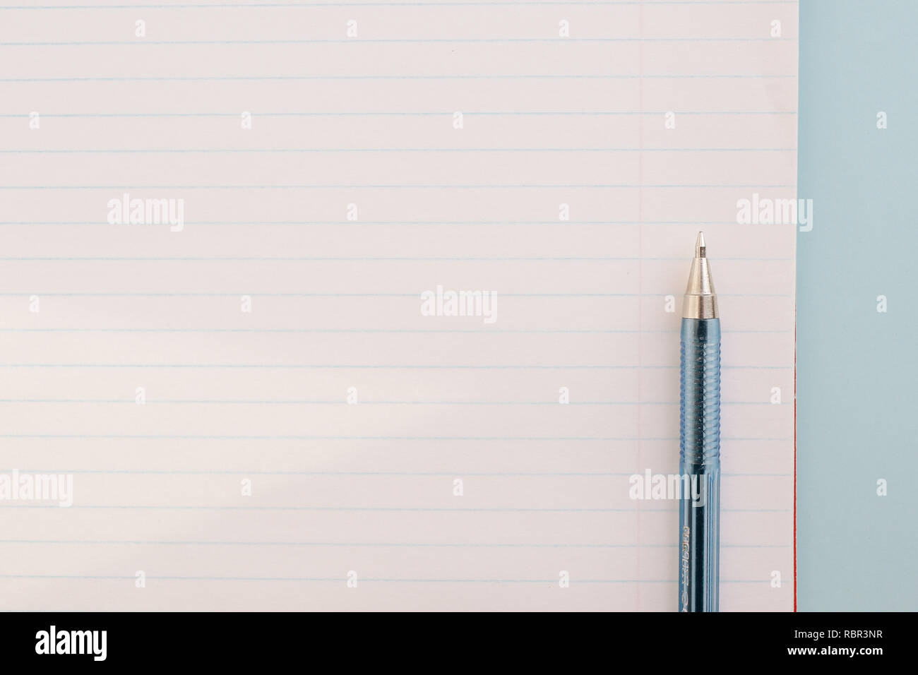 Ball pen and office pad, clear notebook, close up, copy space Stock ...