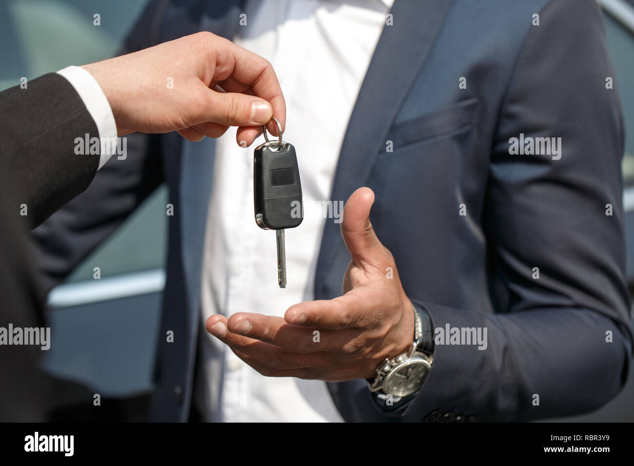 Young car seller standing hi-res stock photography and images - Alamy