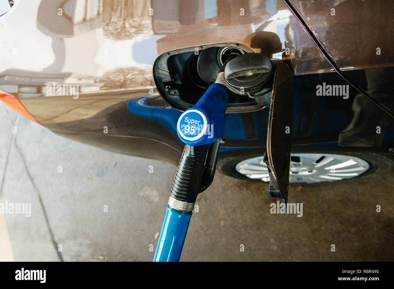 Super 95 E10 sing on the pumping gasoline fuel in car at gas station ...