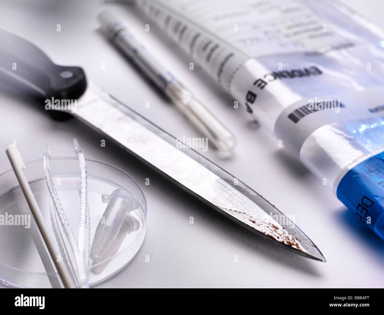 Forensic evidence collection. A knife about to be swabbed for DNA ...