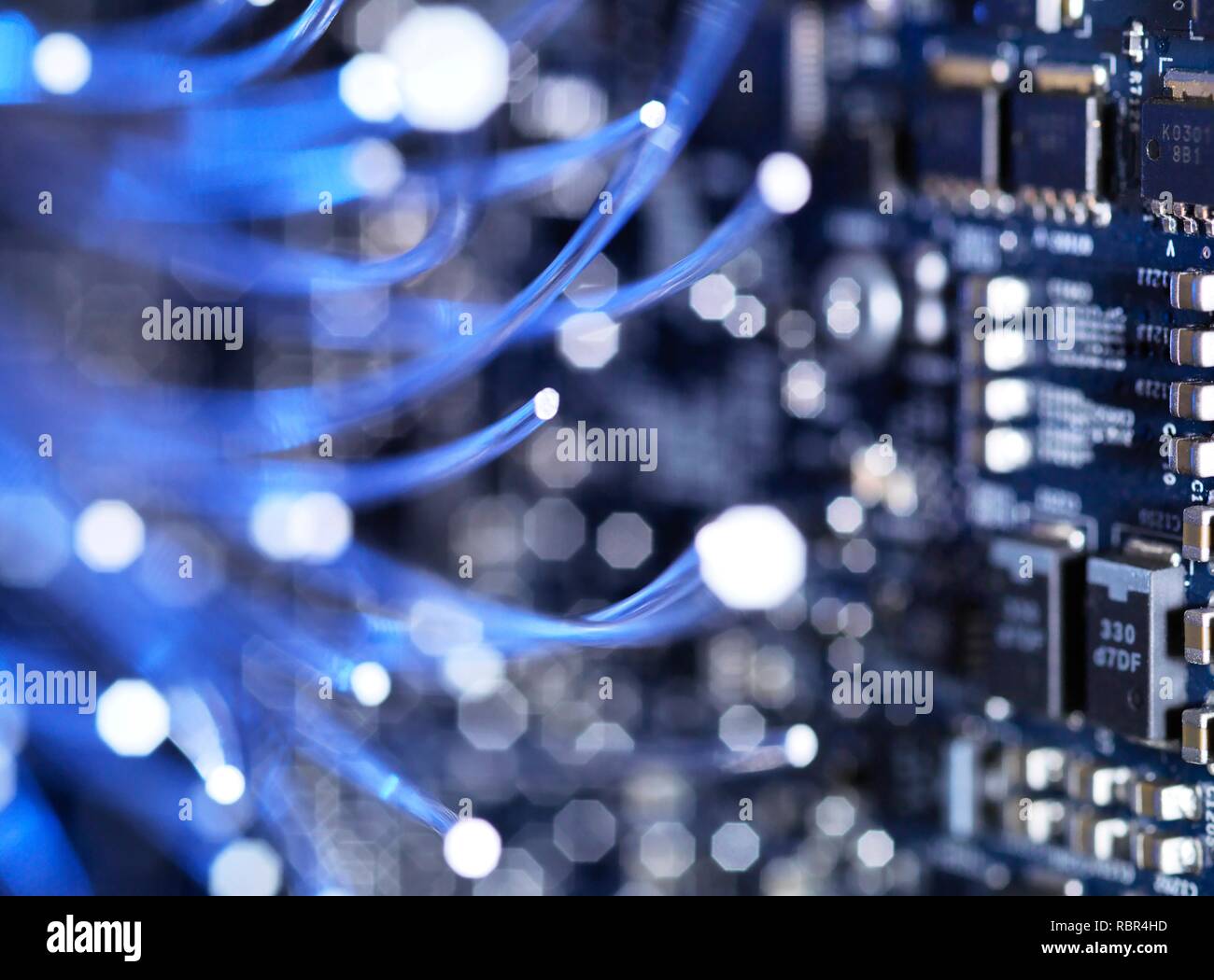 Fibre optics carrying data over electronic circuitry on a laptop ...