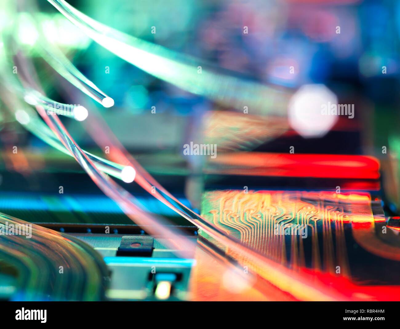 Fibre optics carrying data over electronic circuitry on a laptop ...