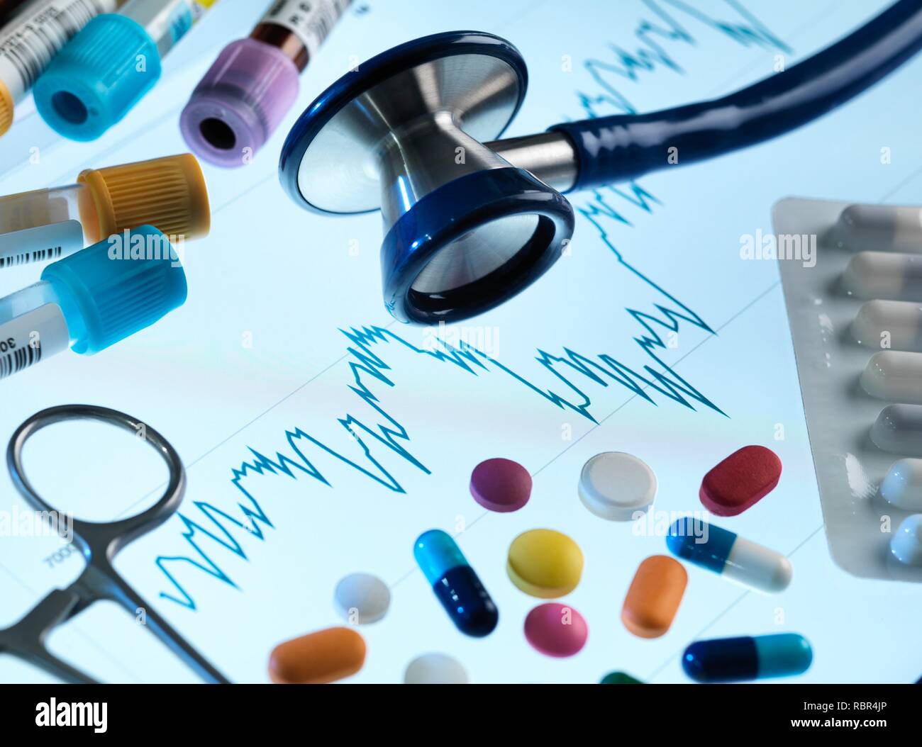 Stethoscope, medicine and medical samples sitting on a share price ...