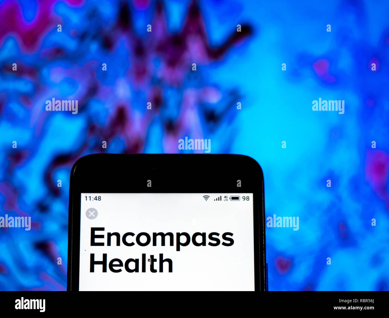 Encompass Health, Healthcare company logo seen displayed on smart phone ... Encompass Health, Healthcare company logo seen displayed on smart phone ...