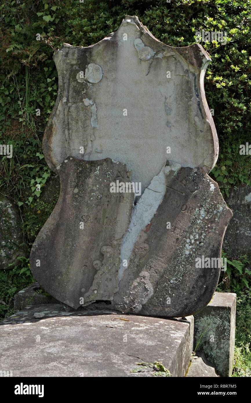 A broken tombstone in the Oura international cemetery Stock Photo - Alamy