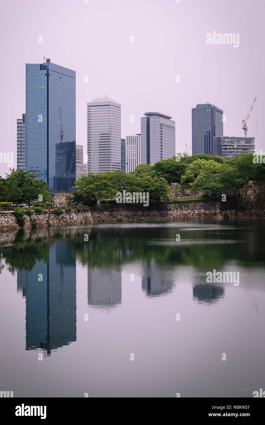 Osaka city modern downtown building with reflection in water Stock ...