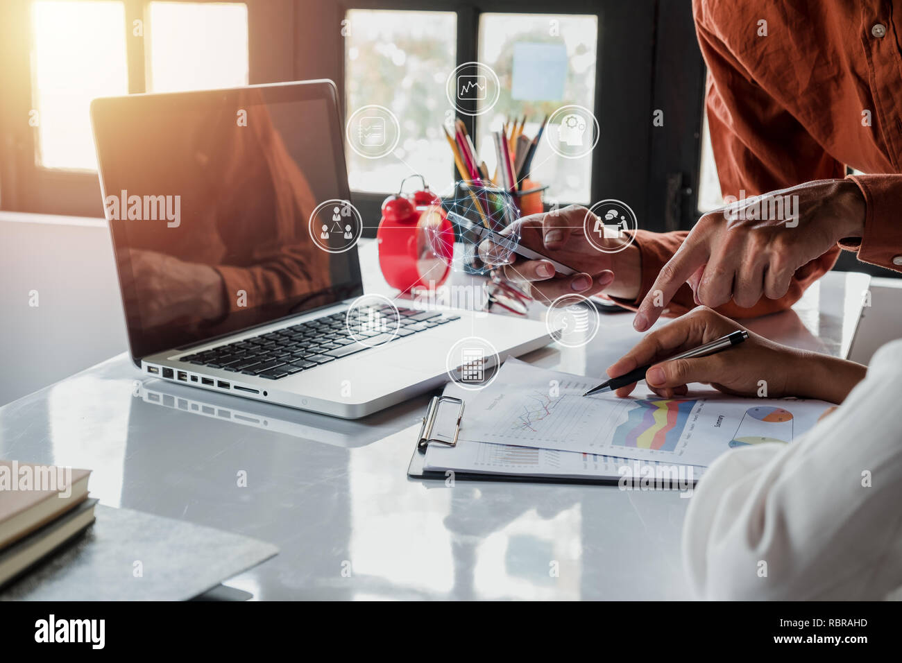 Business team meeting concept,Two colleagues discussing data with smart ...