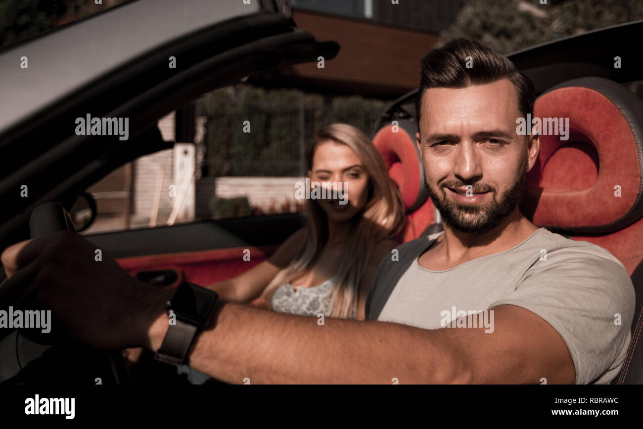 close up.a handsome man driving a luxury car Stock Photo - Alamy