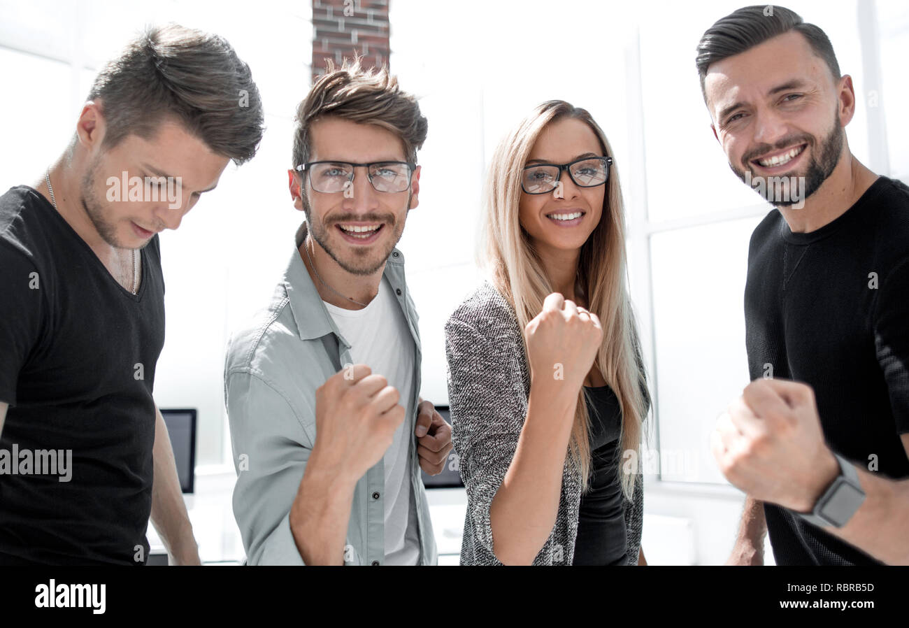 Business team celebrating a good job in the office Stock Photo - Alamy
