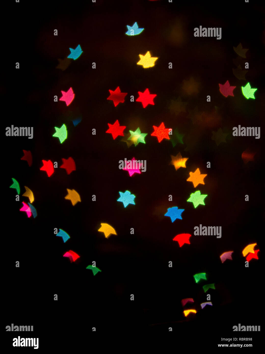 Christmas lights with a home made star filter Stock Photo - Alamy