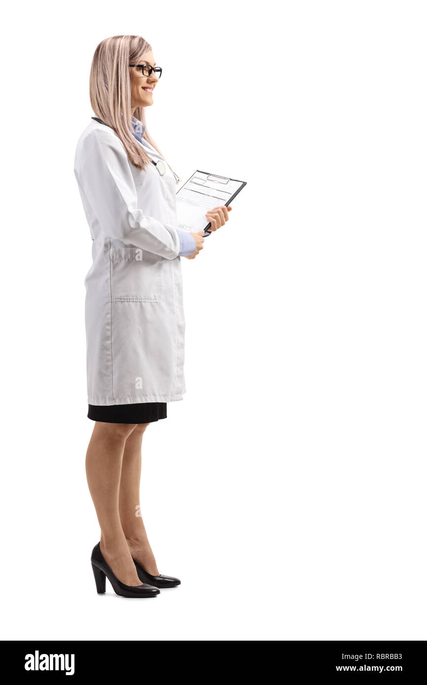 Full length profile shot of a young blond female doctor in a lab coat ...