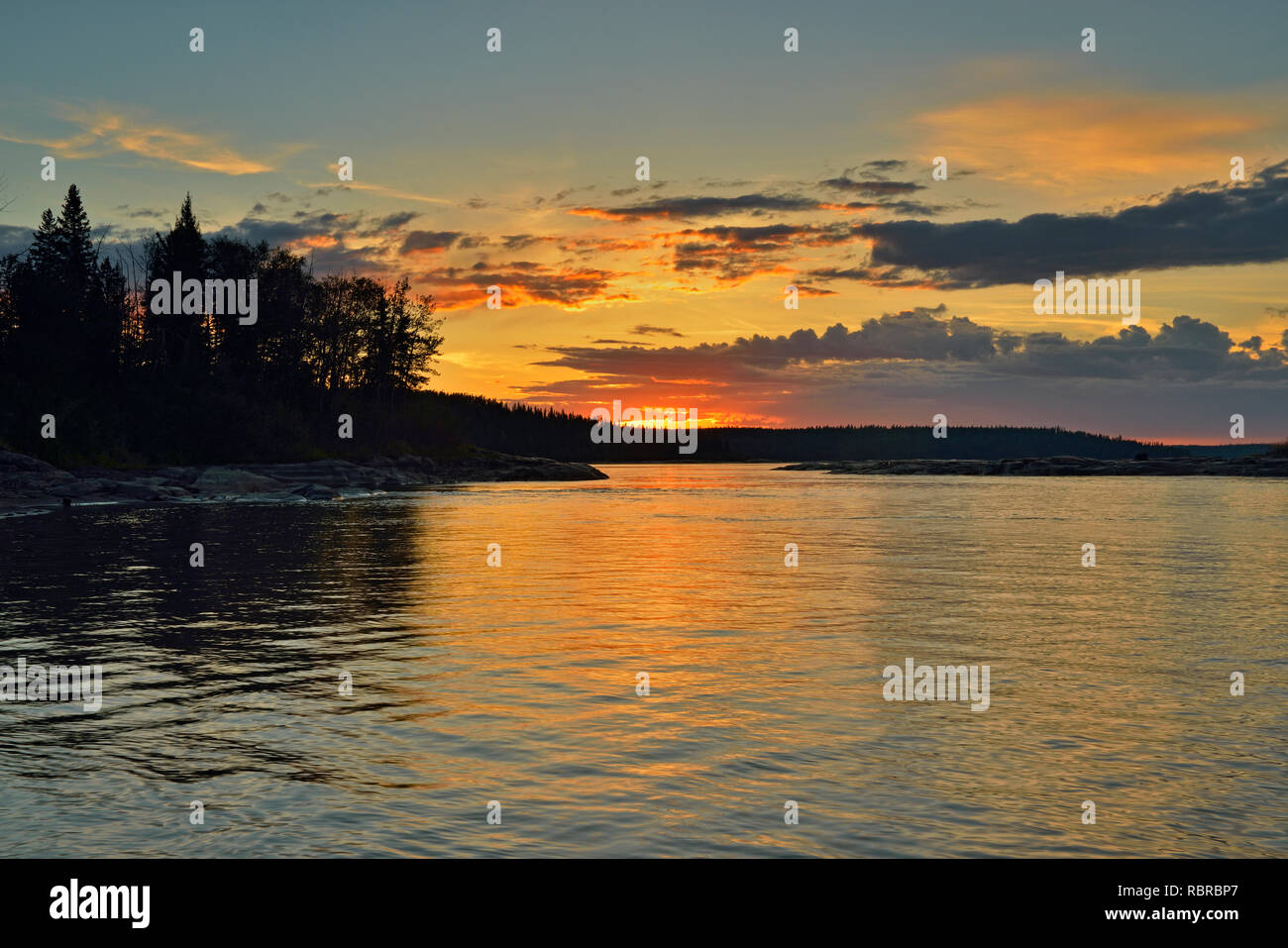Evening sky reflected in the Slave River, Fort Smith, Northwest ...