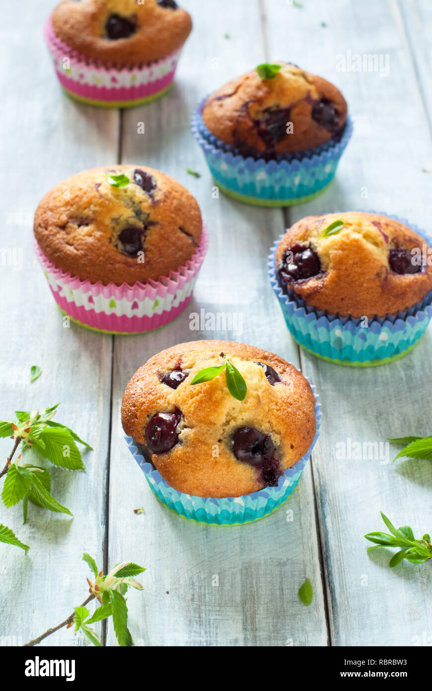 Summer muffins with cherry at wooden table Stock Photo - Alamy