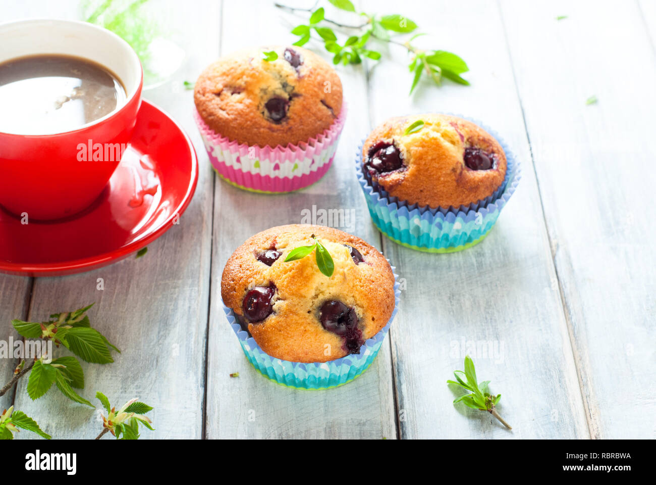 Summer muffins with cherry at wooden table Stock Photo - Alamy
