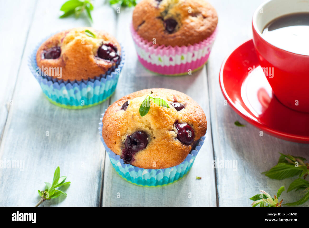 Summer muffins with cherry at wooden table Stock Photo - Alamy