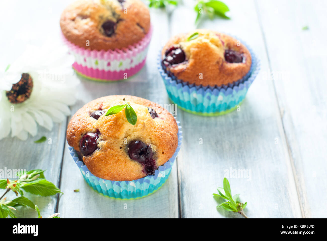 Summer muffins with cherry at wooden table Stock Photo - Alamy