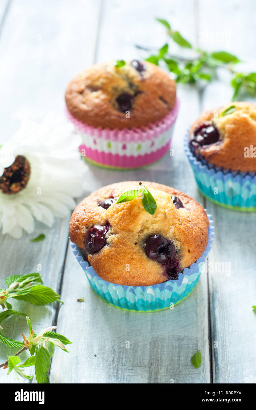 Summer muffins with cherry at wooden table Stock Photo - Alamy