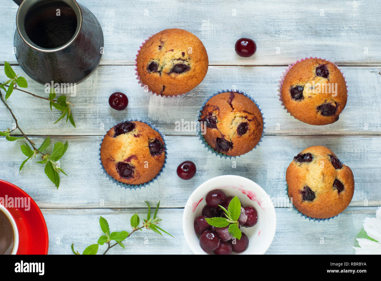 Summer muffins with cherry at wooden table Stock Photo - Alamy