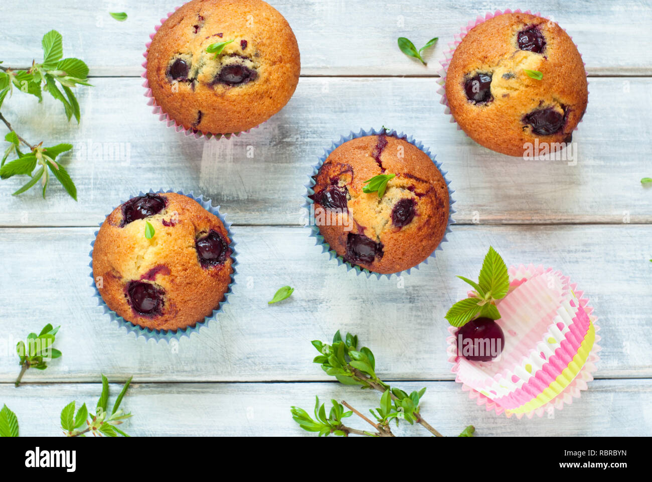 Summer muffins with cherry at wooden table Stock Photo - Alamy