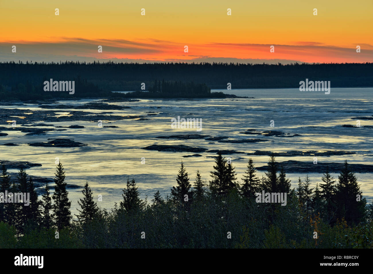 Dawn skies overlooking the Slave River and the Rapids of the Drowned ...