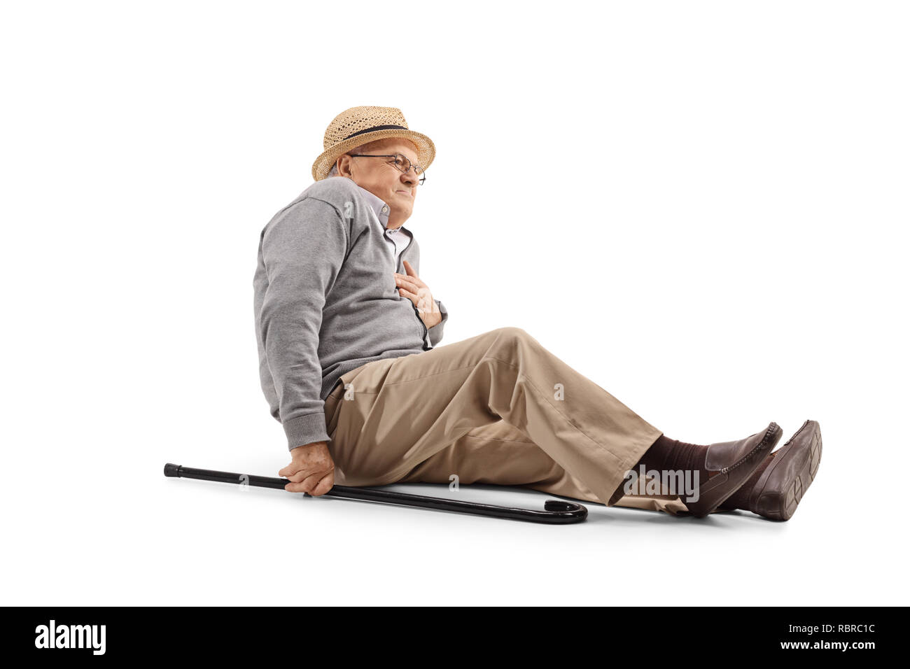 Elderly man on the floor heaving a chest pain isolated on white ...