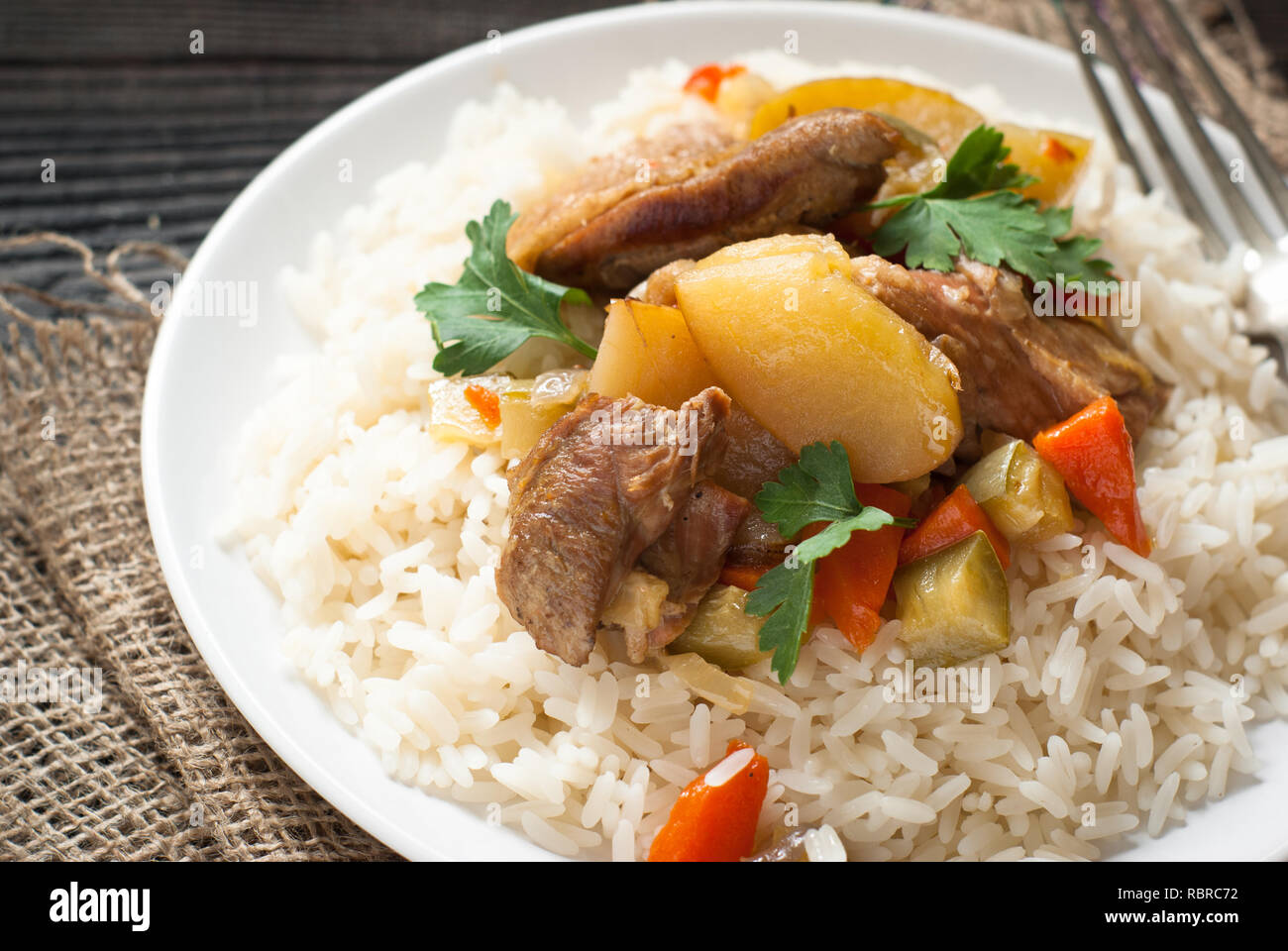Risotto with white rice, meat and vegetables Stock Photo - Alamy