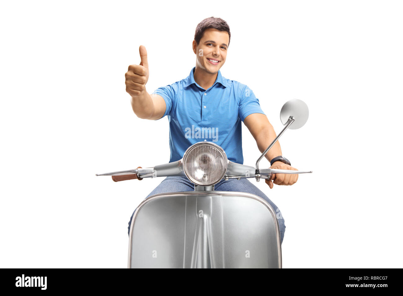 Smiling young man riding a vintage motorbike and showing thumbs up ...