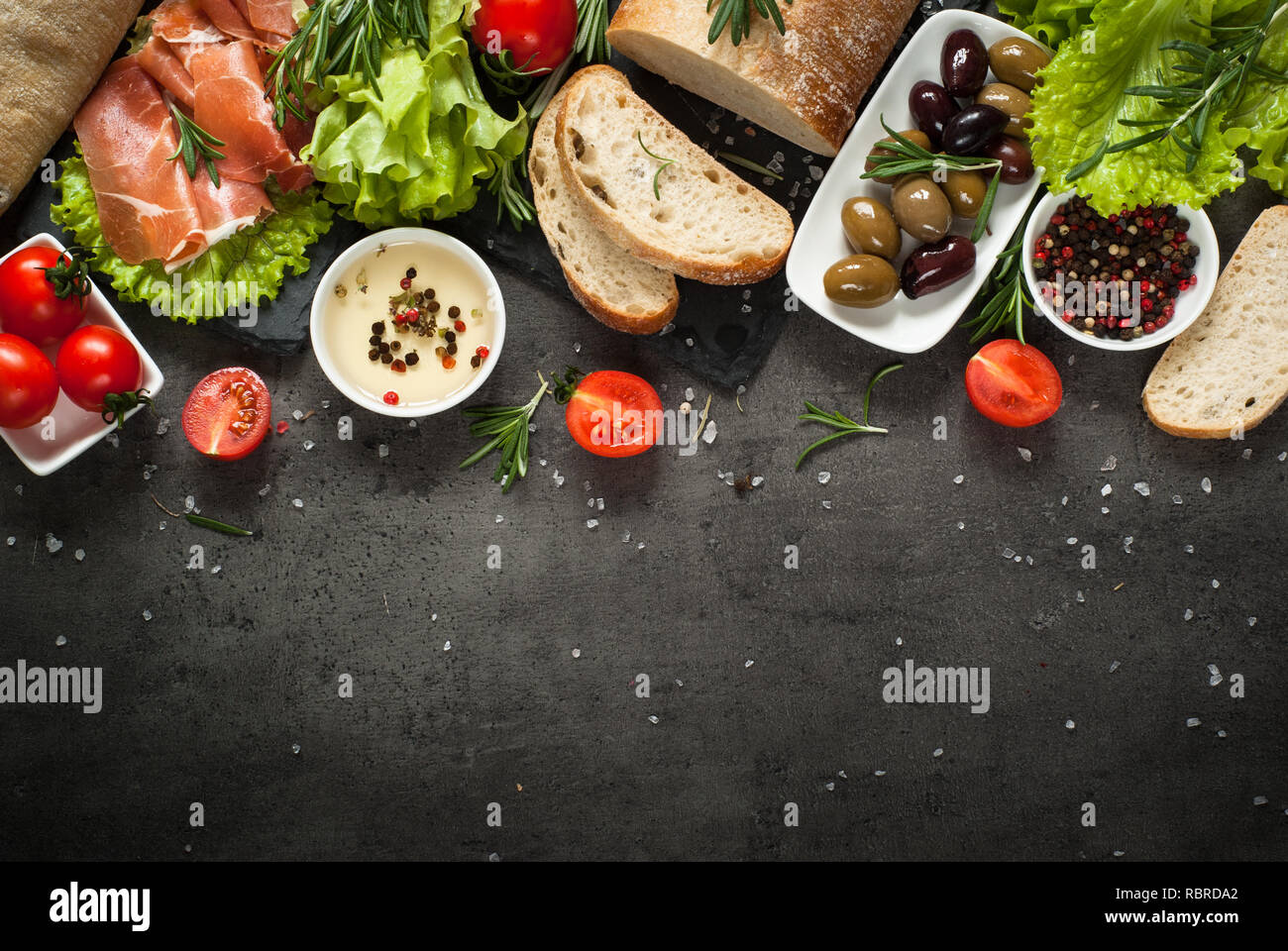 Mediterranean Food background. Ciabatta bread jamon serrano tomatoes ...