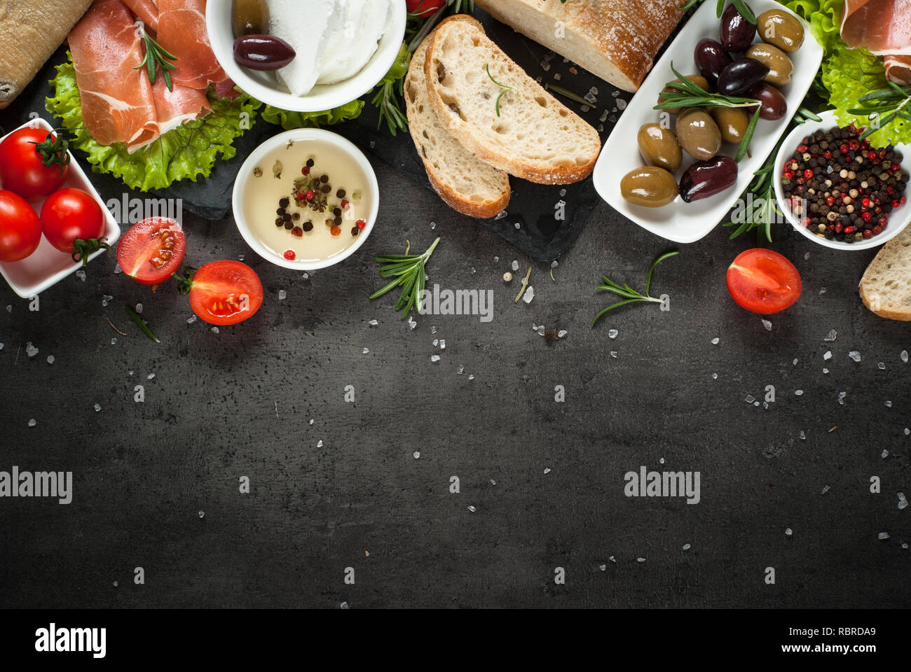 Mediterranean Food background. Ciabatta bread jamon serrano tomatoes ...