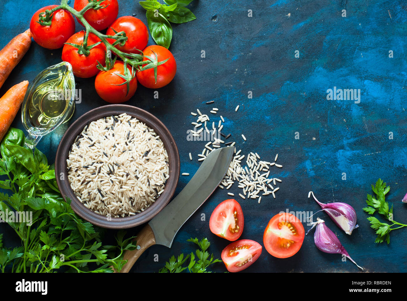 Ingredients for cooking - rice, vegetables and herbs. Top view with ...