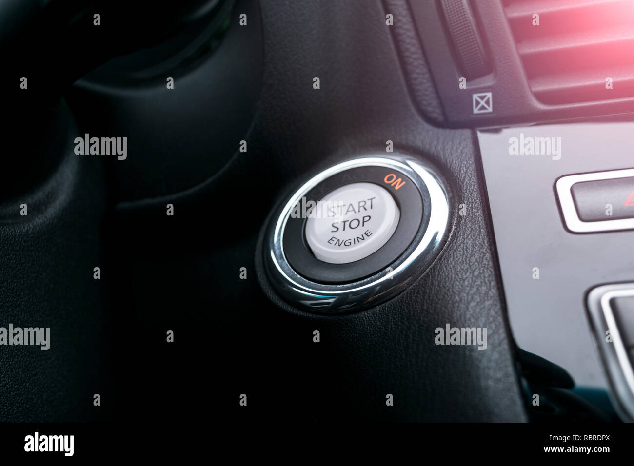Car dashboard with focus on engine start stop button, Modern car ...