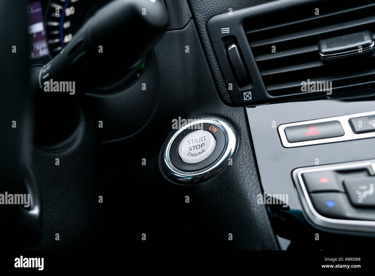 Car dashboard with focus on engine start stop button, Modern car ...
