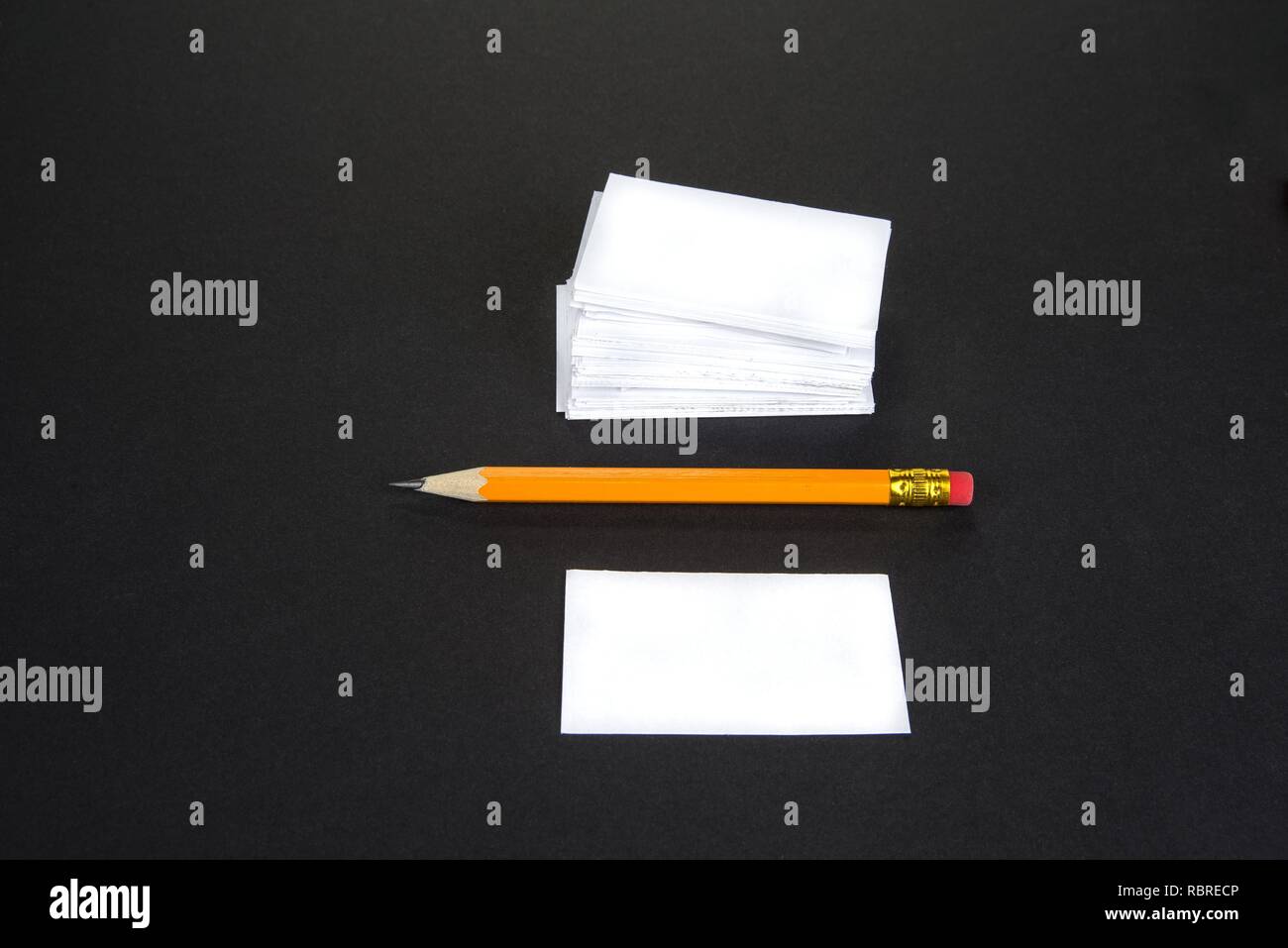 Stack of white paper notes with pencil Stock Photo - Alamy