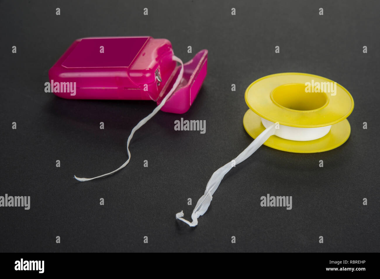 Plumber pipe thread and tape seal isolated on a black Stock Photo - Alamy