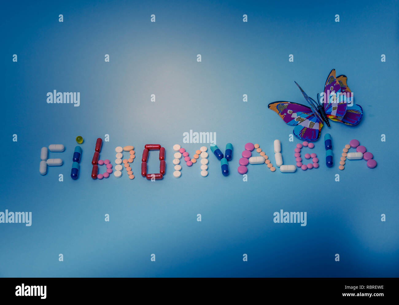 The word Fibromyalgia written by colorful medicines, pills, drugs ...