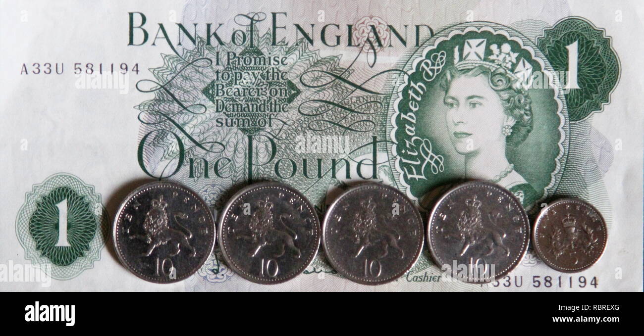 Bank of England One Pound note and 45 pence in coins. Currency . The ...
