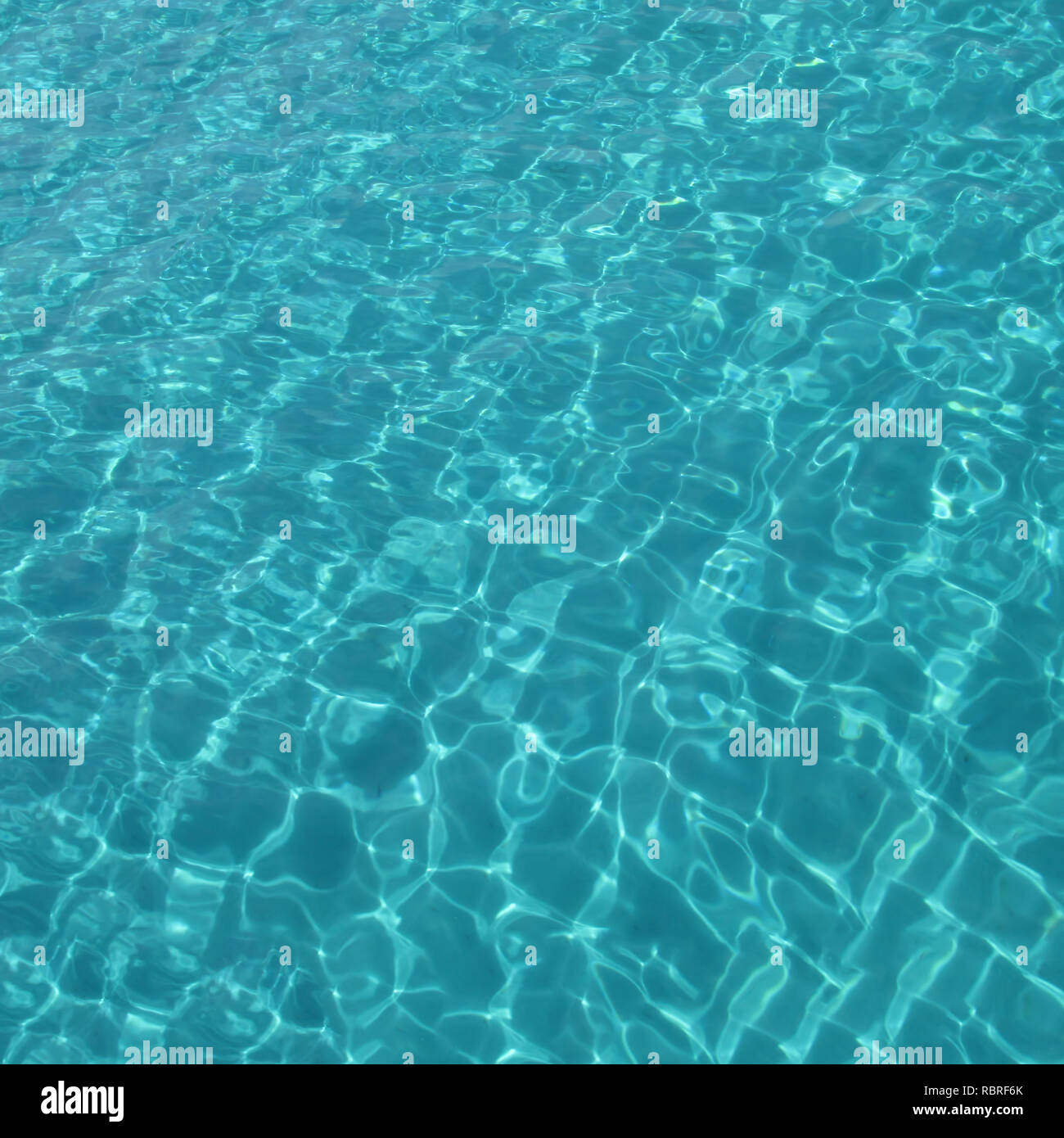 Turquoise color sea surface abstract background, with heart- shaped ...