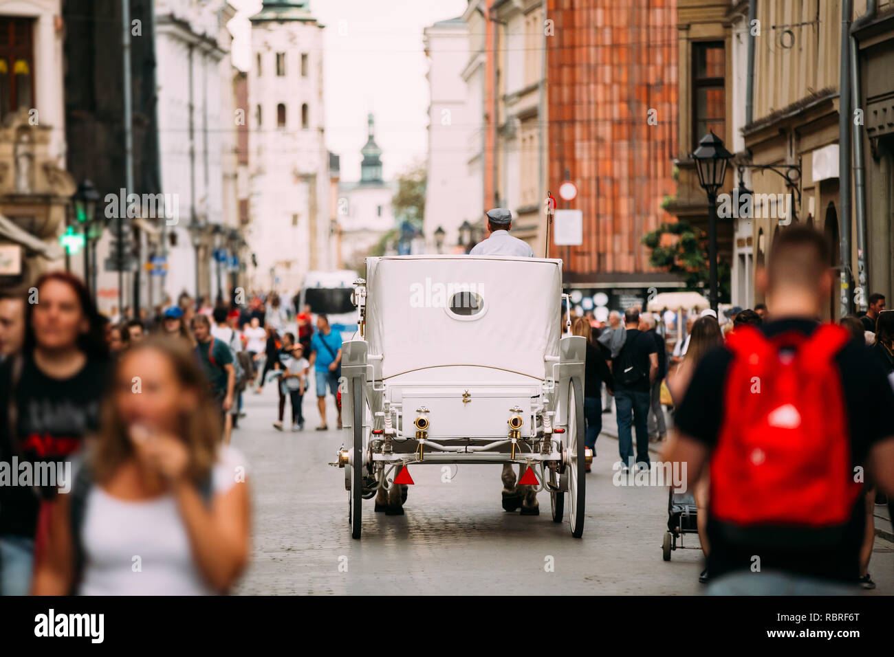 Krakow, Poland. Old-fashioned Coach Carriage Moving At Old Town Streets ...