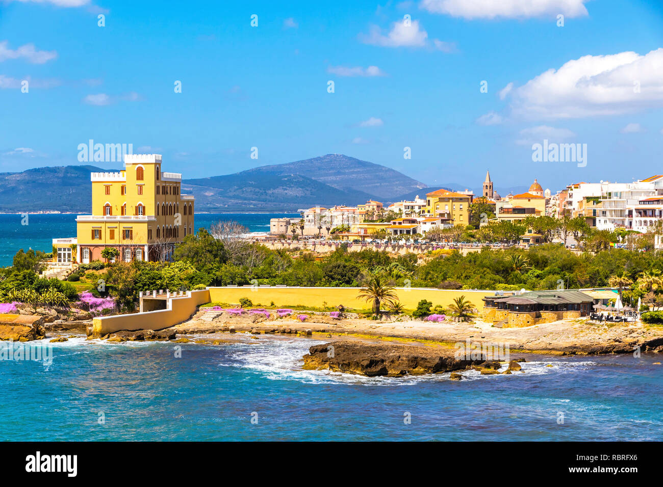 Mediterranean seacoast in Alghero city, Sardinia, Italy. Spring flowers ...
