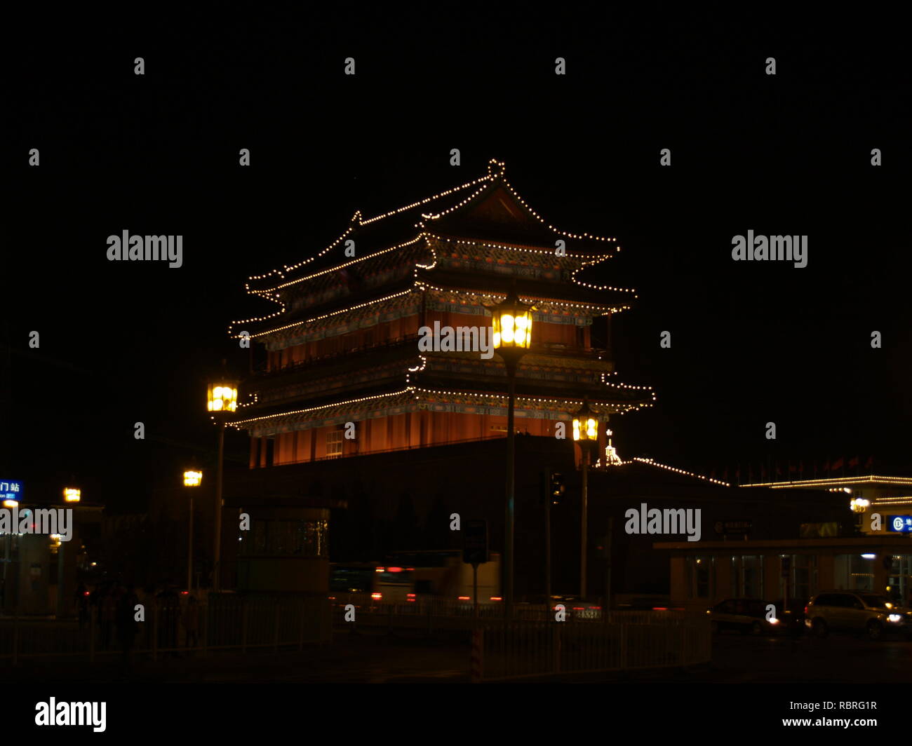 Chinese city gate lit at night Stock Photo - Alamy