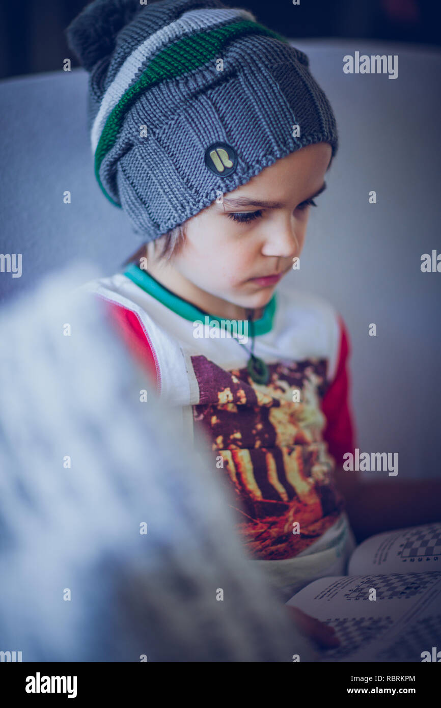 Teen boy reading at home hi-res stock photography and images - Alamy