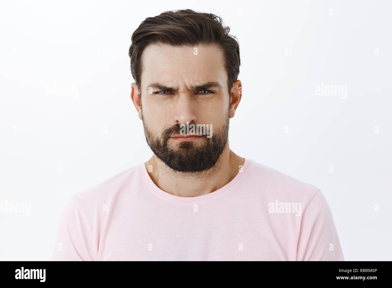 You look suspicious. Portrait of intense serious-looking handsome man ...