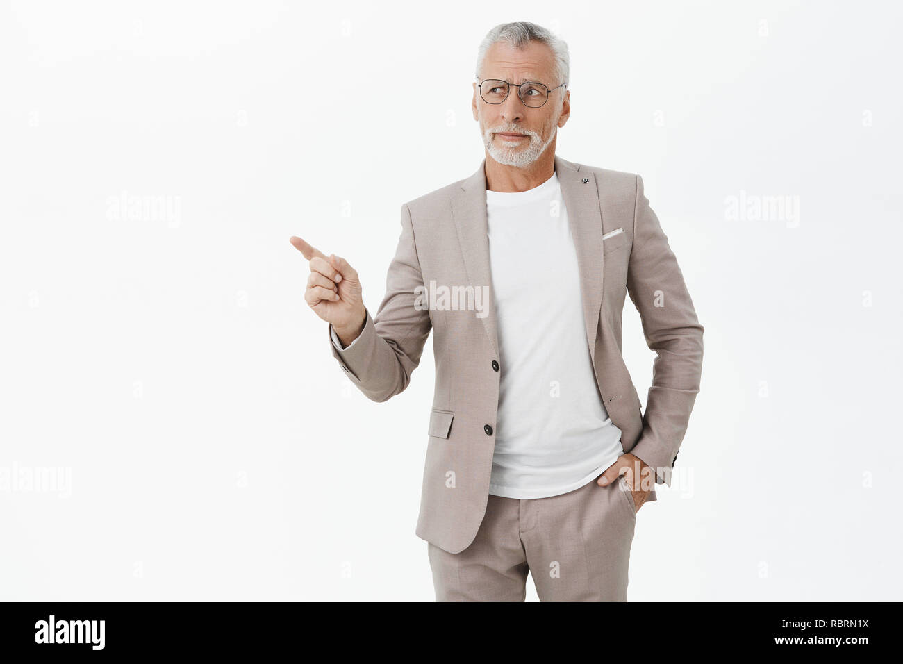 Unretouched shot of good-looking intelligent and elegant old man with ...