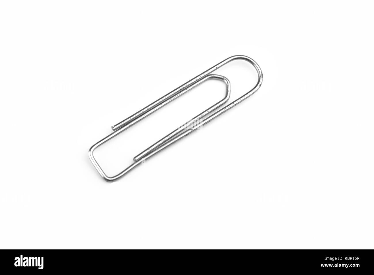 Old steel paper clip isolated on white background. Copy space Stock ...