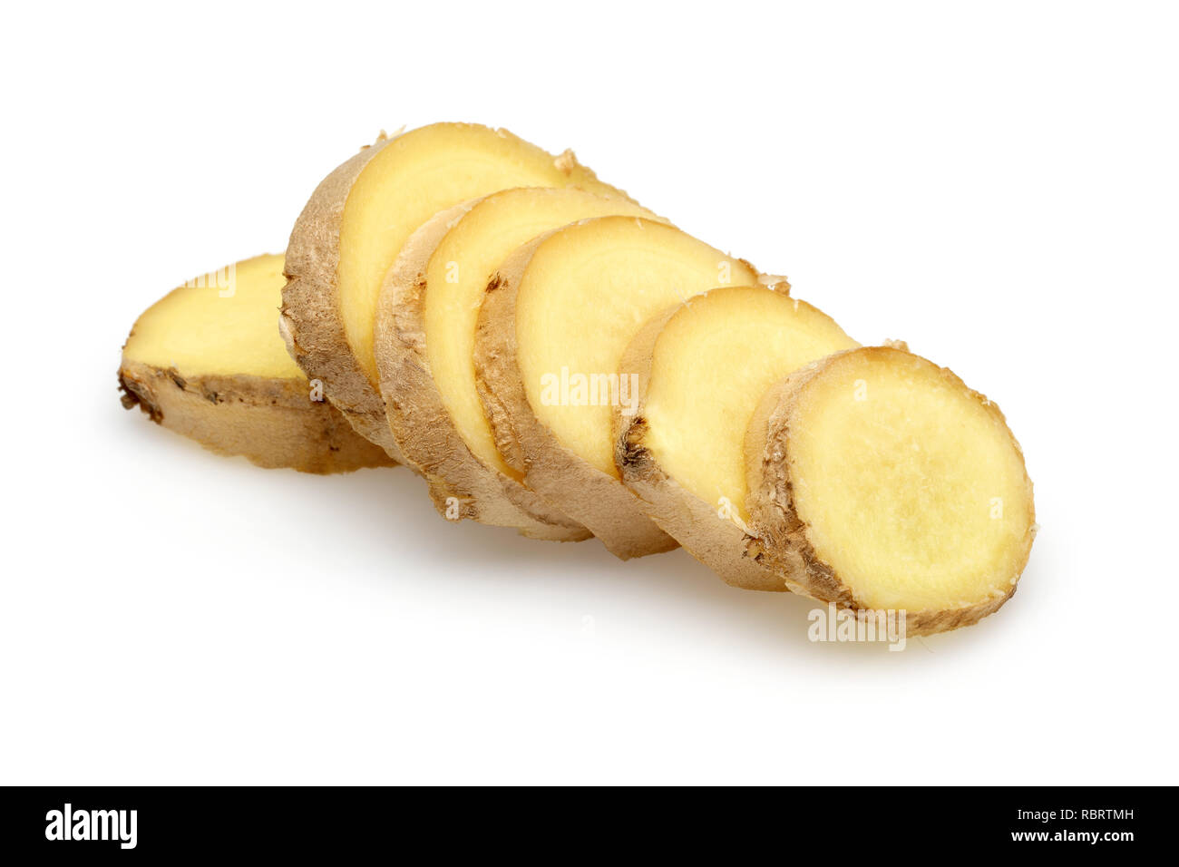 Ginger root slices isolated on white background Stock Photo - Alamy