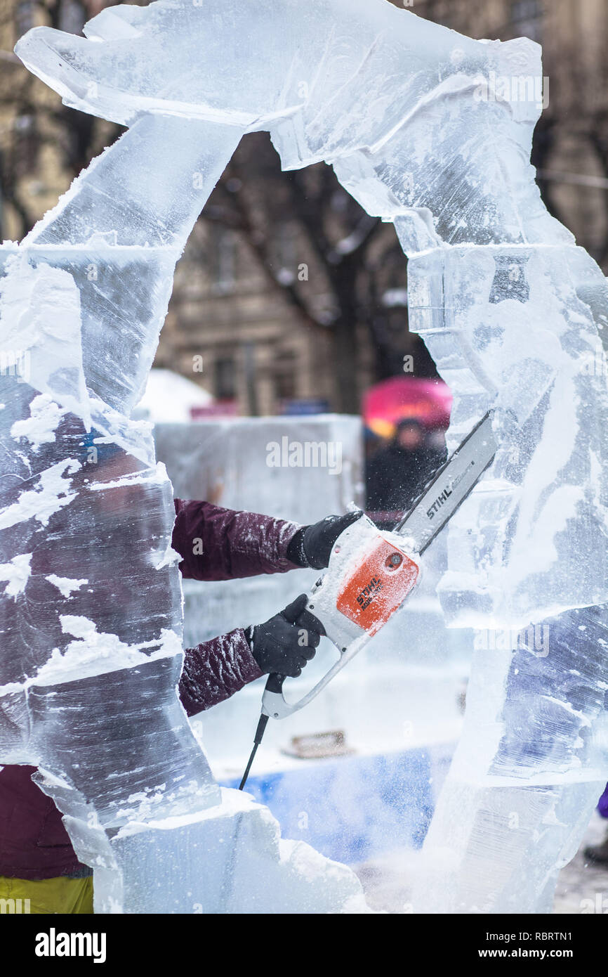 Ukraine, Lviv - January 11, 2019: Master makes ice sculptures from ice ...