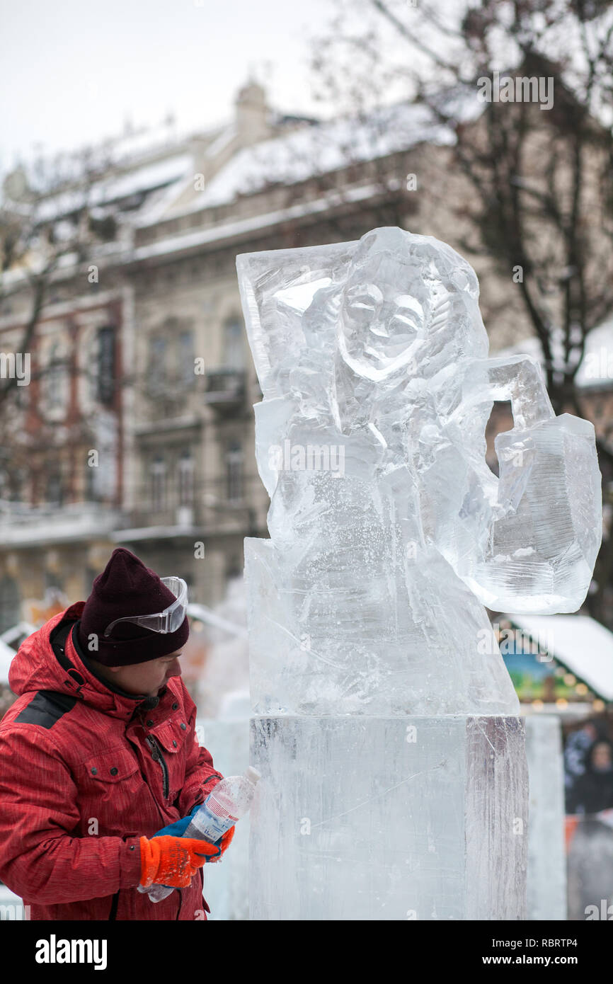 Ukraine, Lviv - January 11, 2019: Master makes ice sculptures from ice ...
