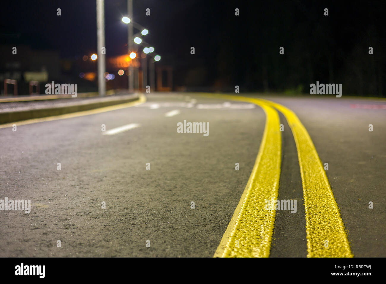 Wide modern smooth empty asphalt highway sharp turn sharp with bright ...