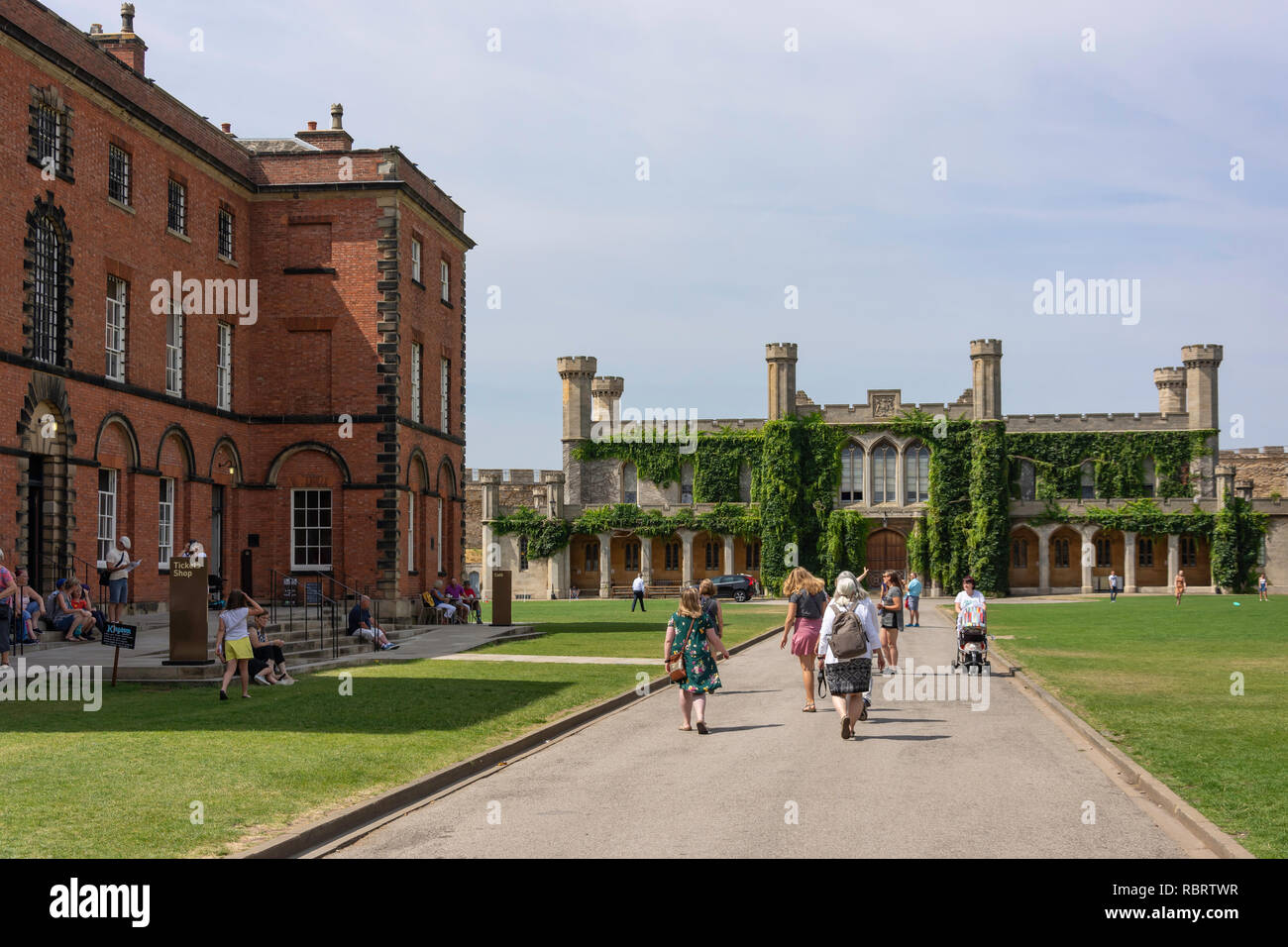 Castle grounds showing ivy-clad Assize Courts (Crown Courts), Lincoln ...